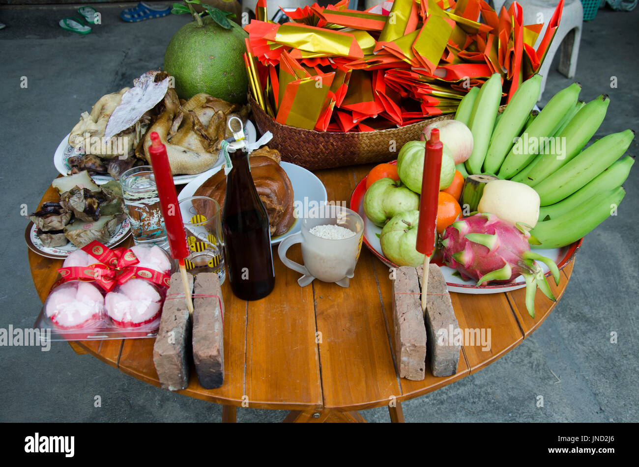 Thai people prepare sacrificial offering food on table for pray god and ...