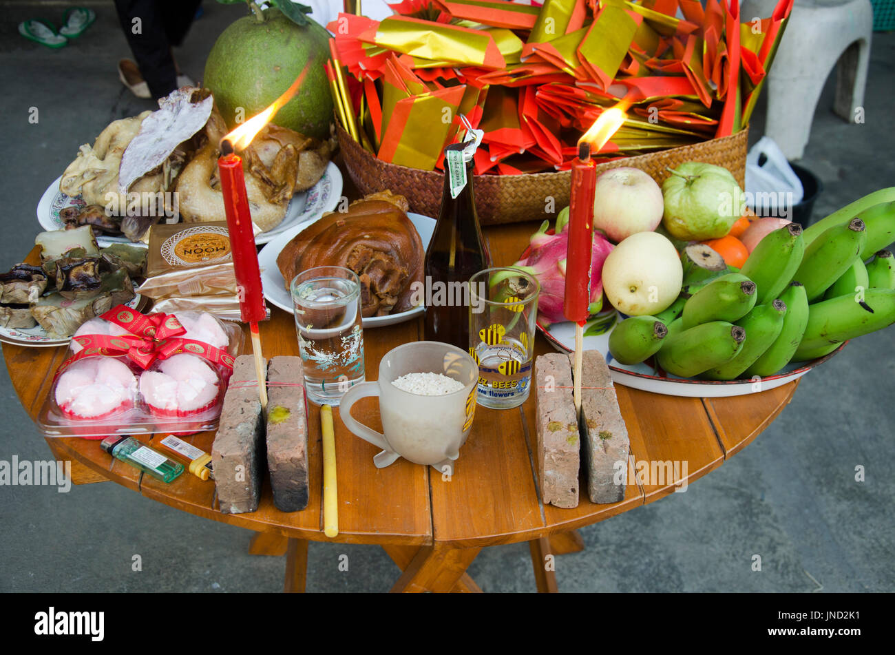 Thai people prepare sacrificial offering food on table for pray god and ...