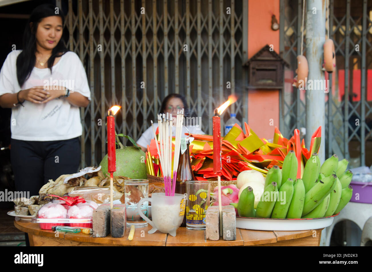 Thai people prepare sacrificial offering food on table for pray god and ...