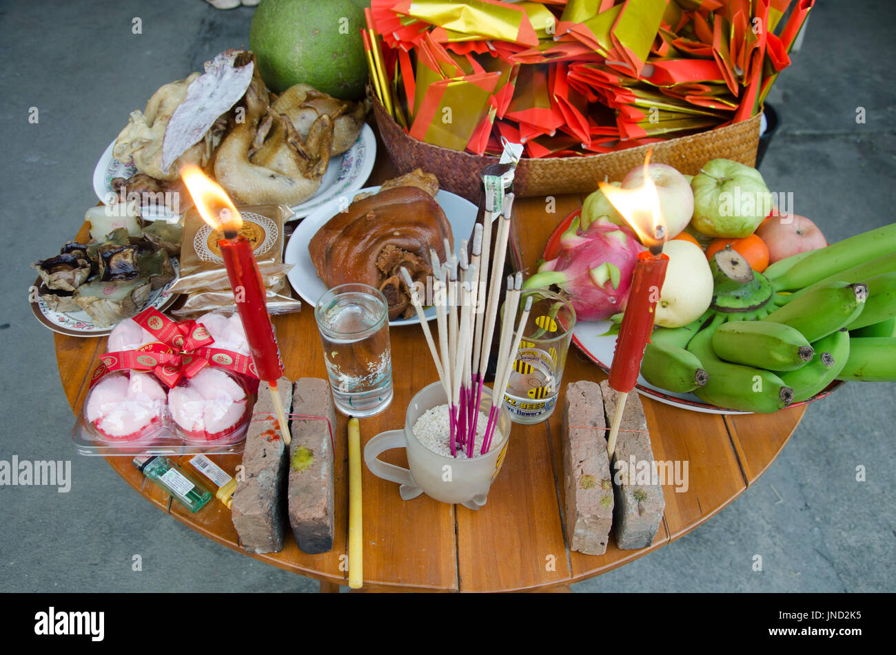 Thai people prepare sacrificial offering food on table for pray god and ...