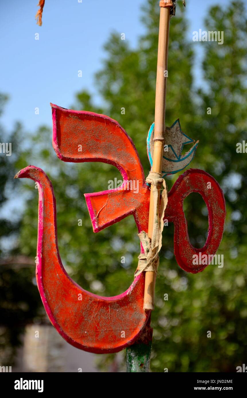 Hindu Om and Muslim crescent star symbols hang together interfaith ...