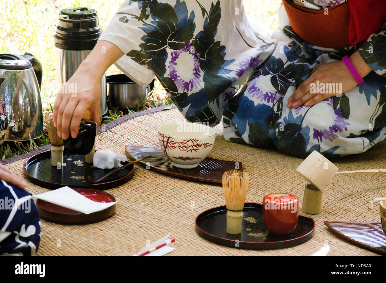 Japanese women making sado chanoyu or Japanese tea ceremony, also ...