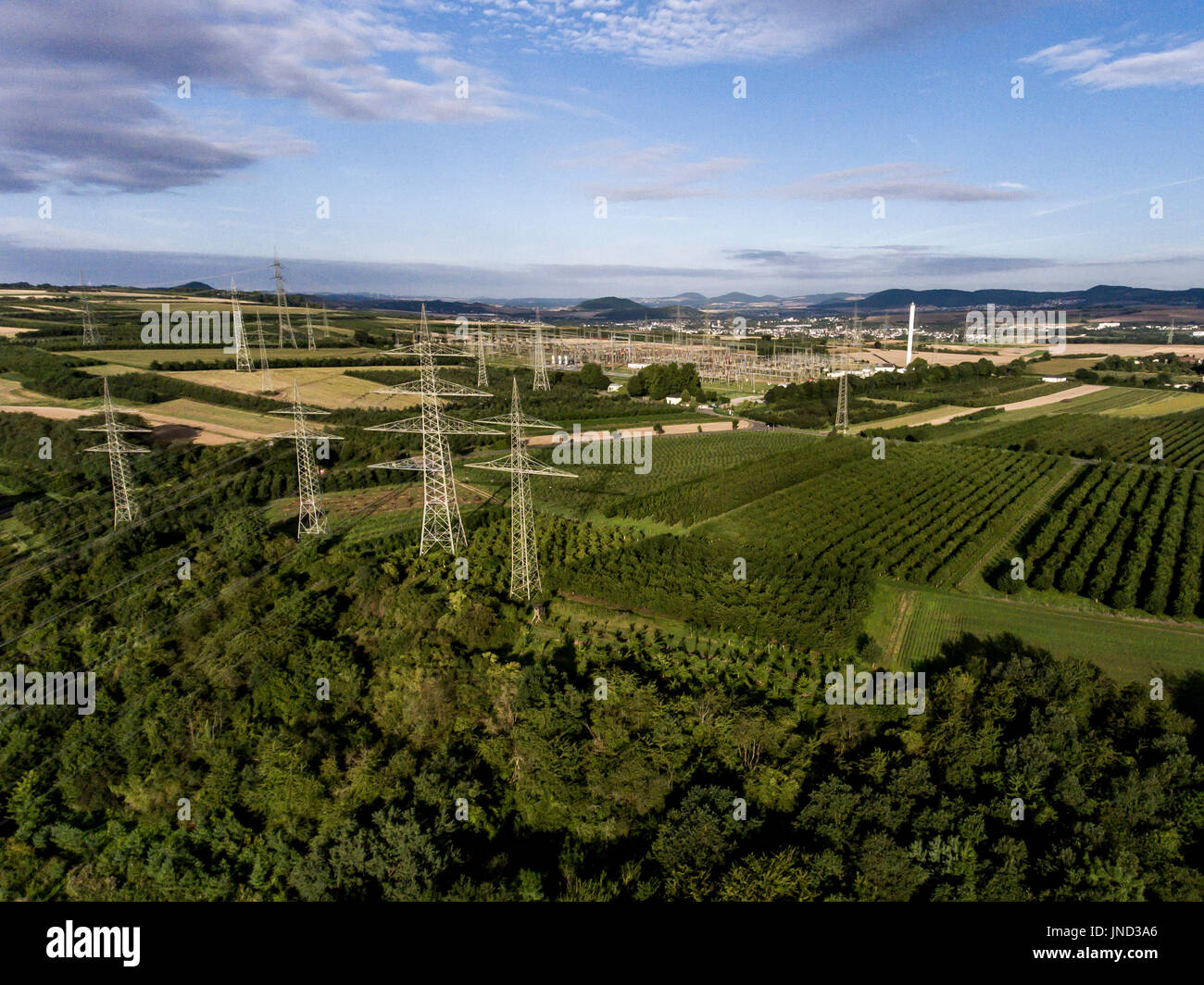 Aerial view High voltage metal post. High-voltage tower. Top view green ...