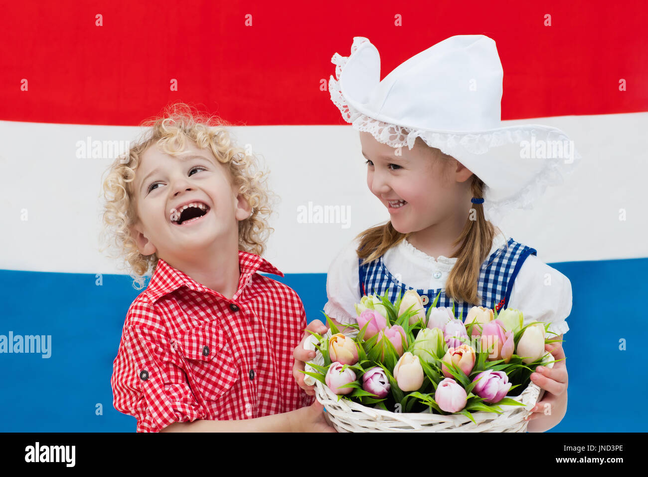 Little Dutch girl and boy wearing traditional national costume, dress ...