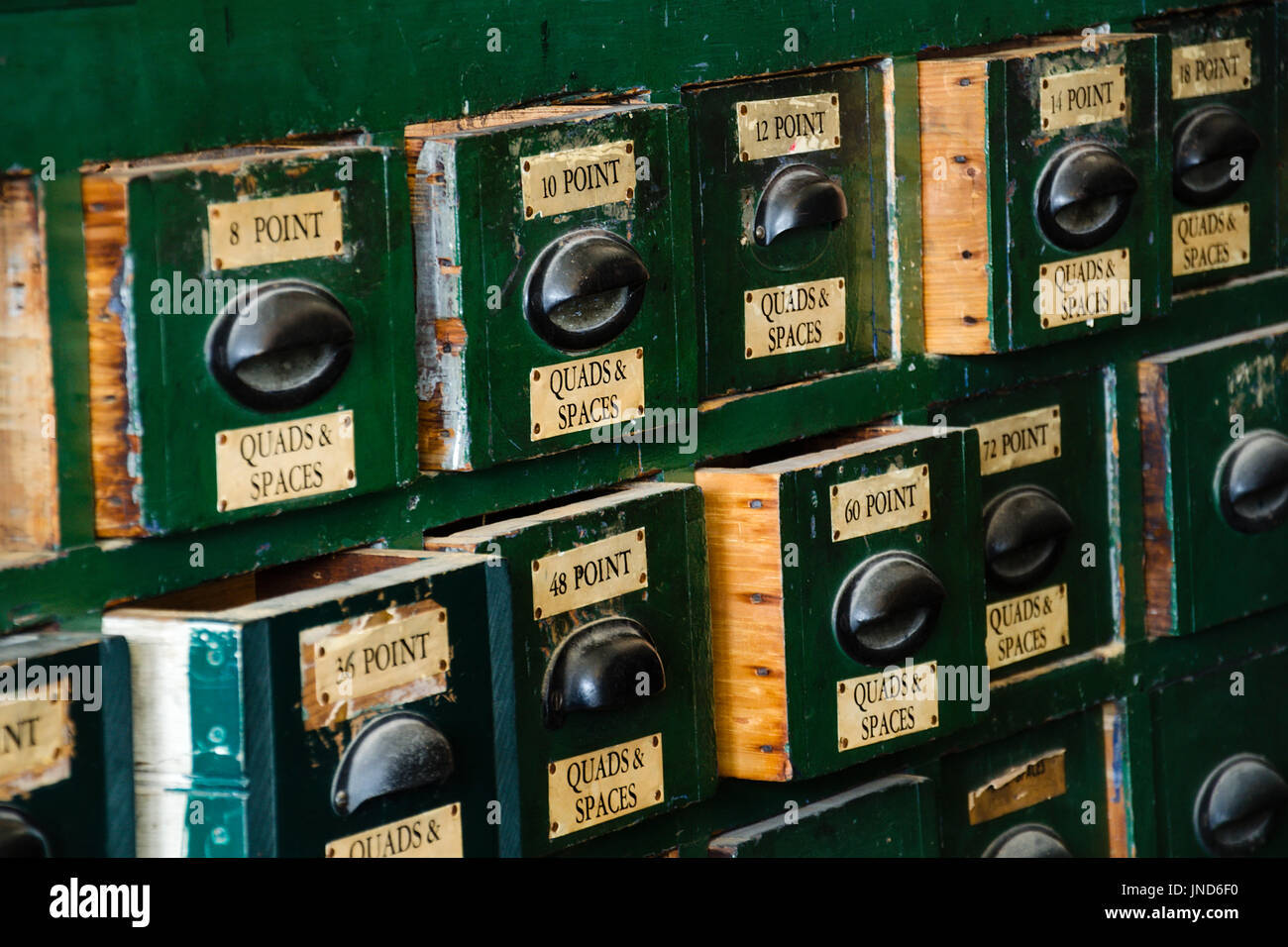 Green antique row of drawers for letters and spaces in print shop Stock ...