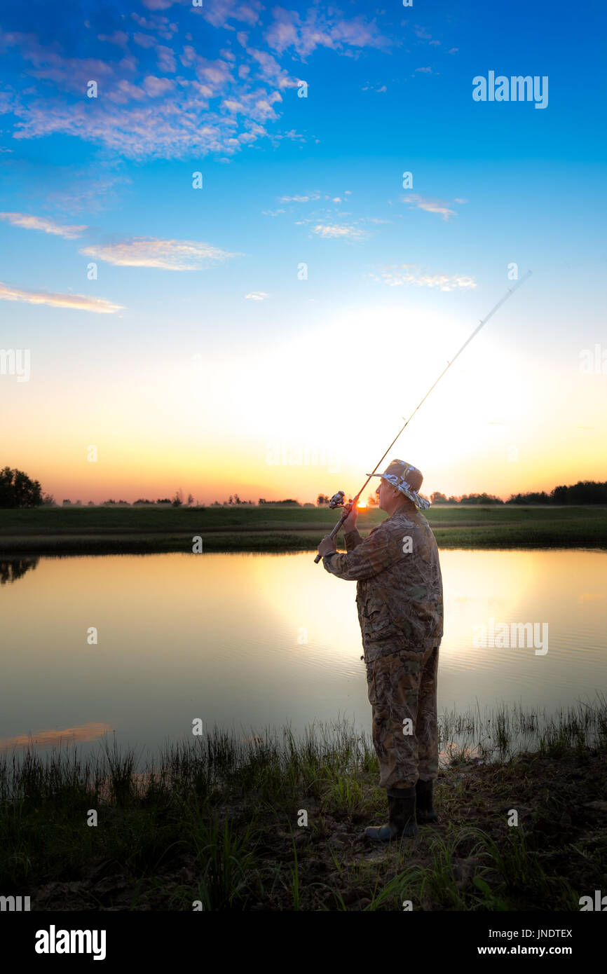 Pike hunter on the river Stock Photo - Alamy