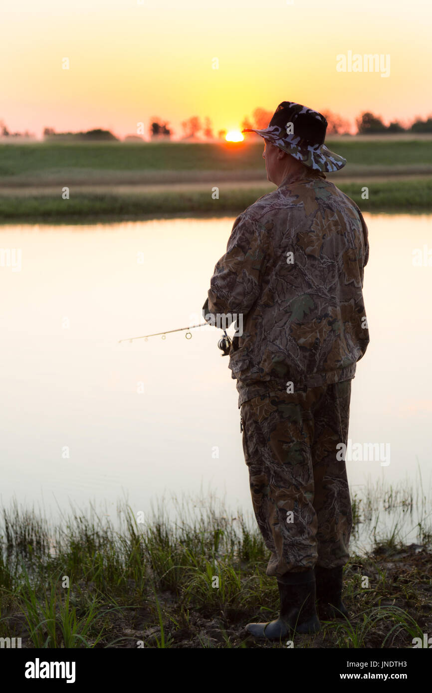 Pike hunter on the river Stock Photo - Alamy