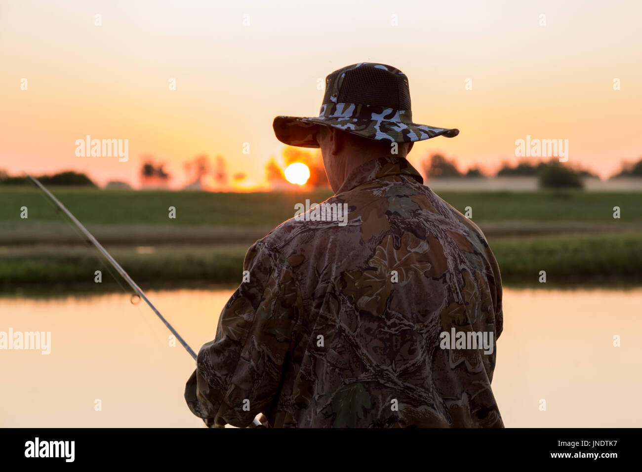 Pike hunter on the river Stock Photo - Alamy