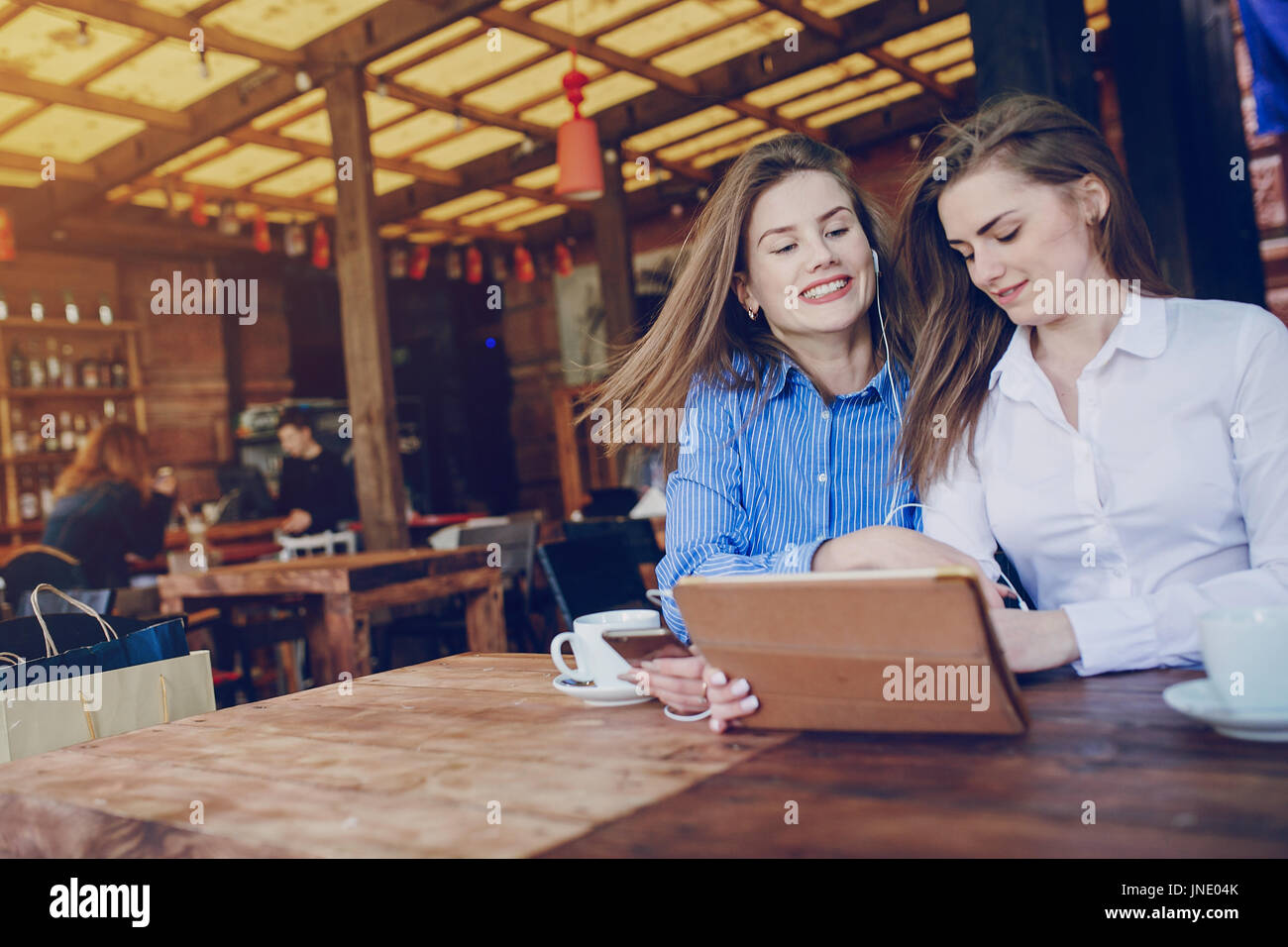two girls in a cafe Stock Photo - Alamy
