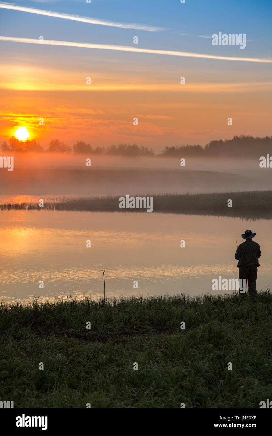 Pike hunter on the river Stock Photo - Alamy