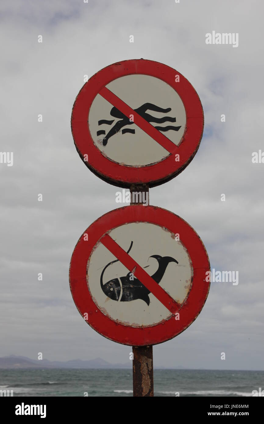 Sign - fishing and bathing prohibited Stock Photo - Alamy