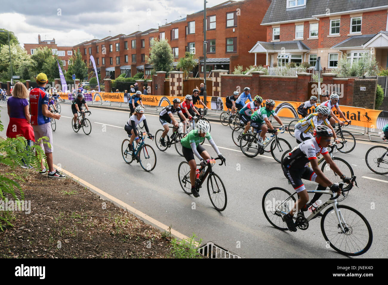 London, UK. 30th July, 2017. Riders pass through Wimbledon village as ...