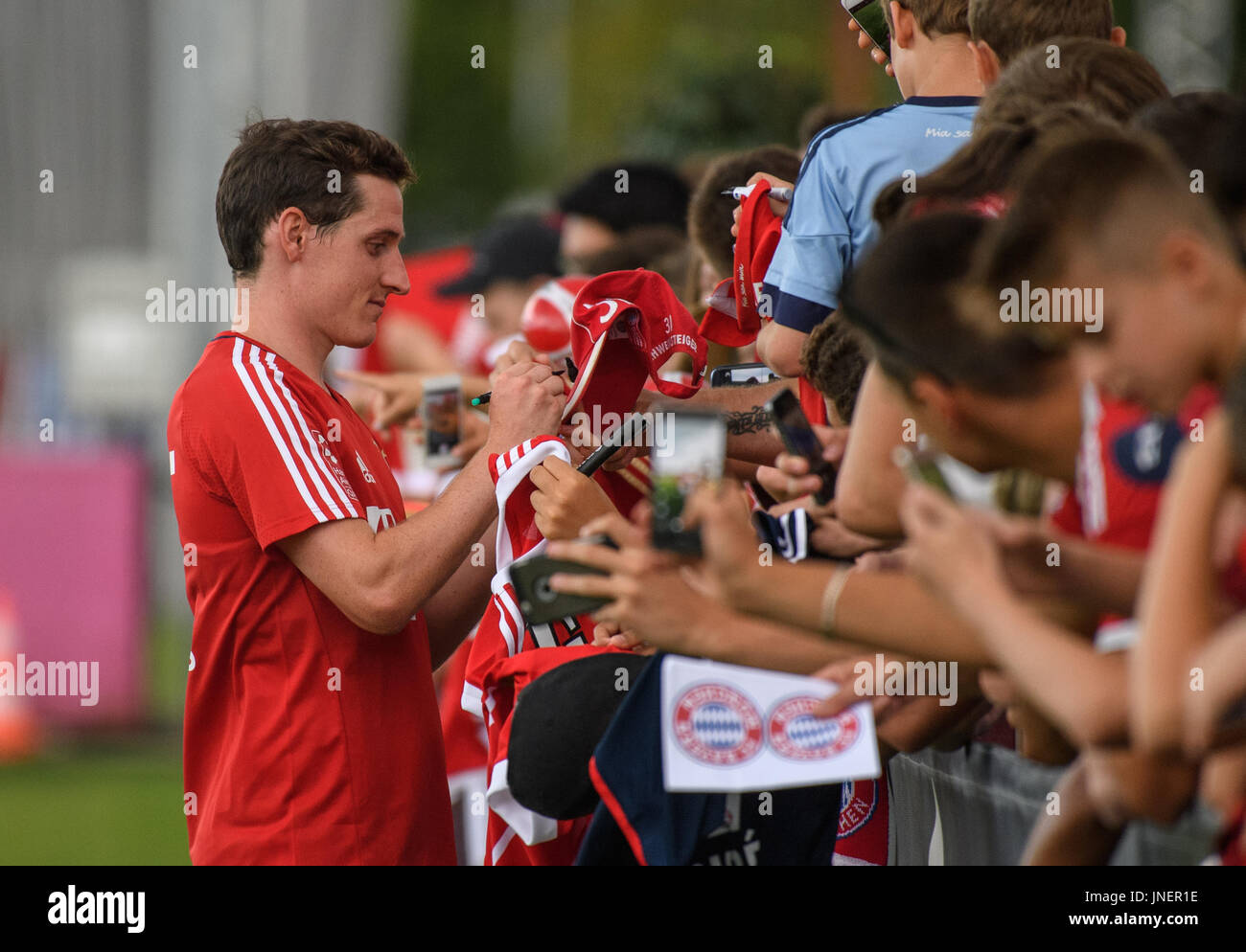 Bayern Munich new signing Sebastian Rudy signs autographs after his ...