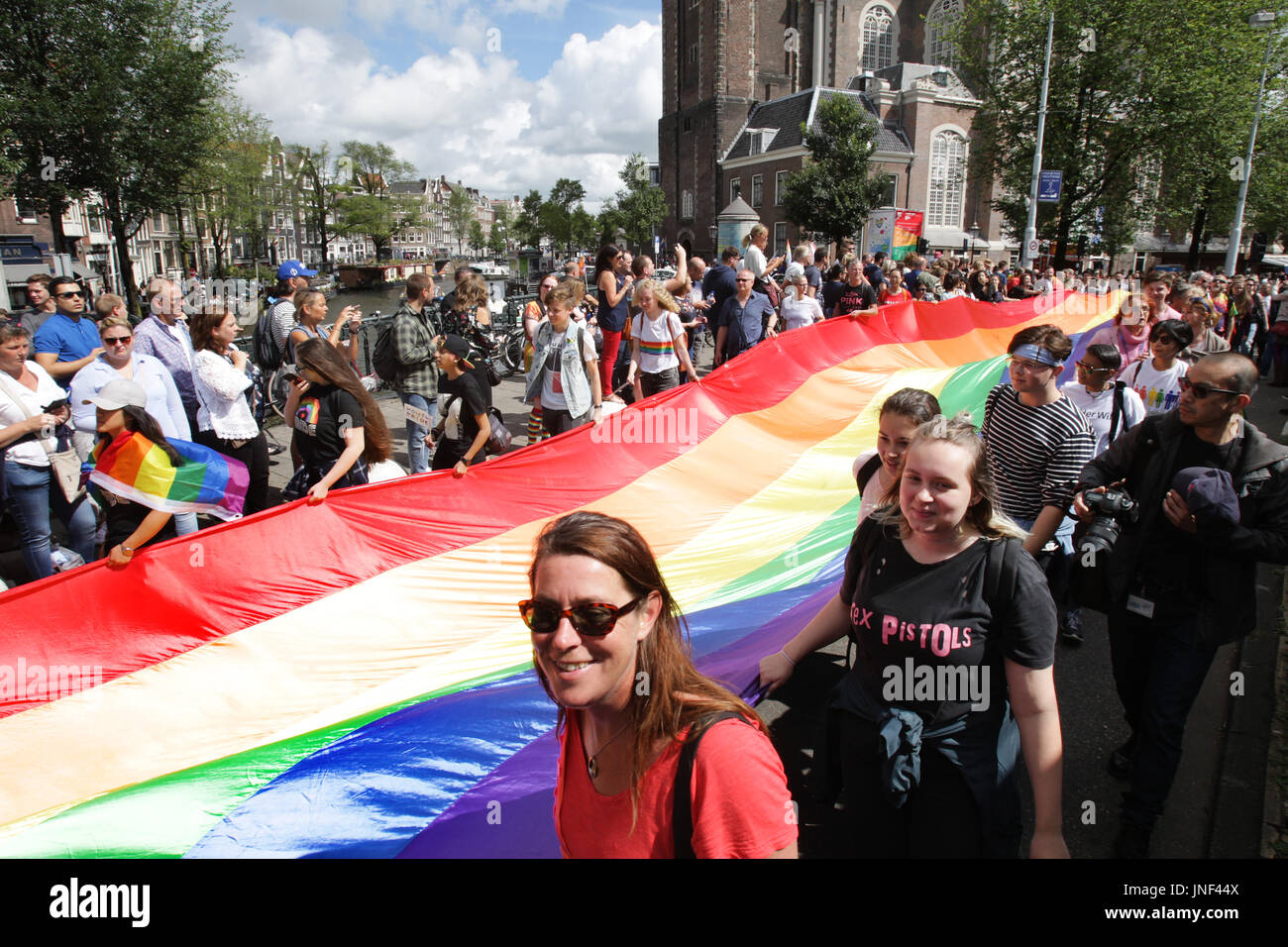 Participants attend the PrideWalk on July 29, 2017 in Amsterdam ...
