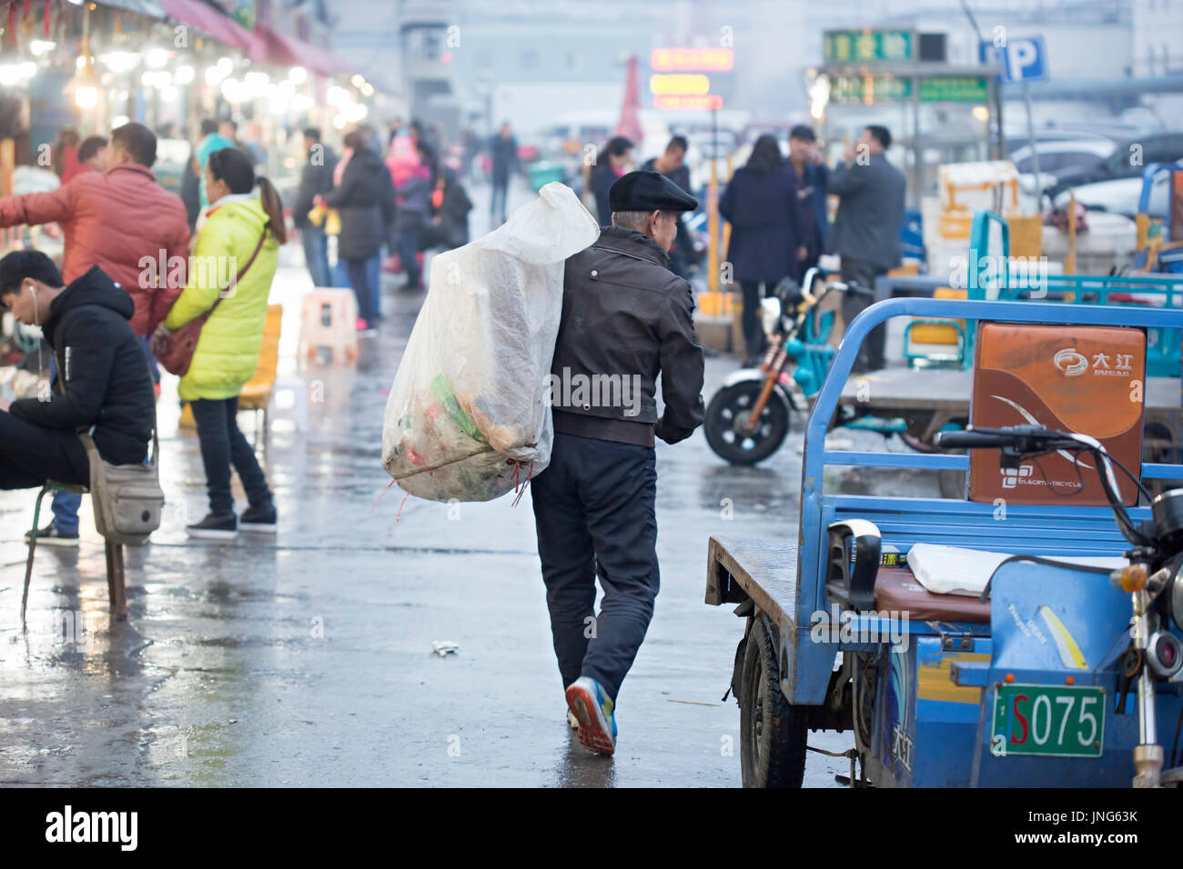 Jing Shen Seafood Market in the evening. Workers packing products after ...