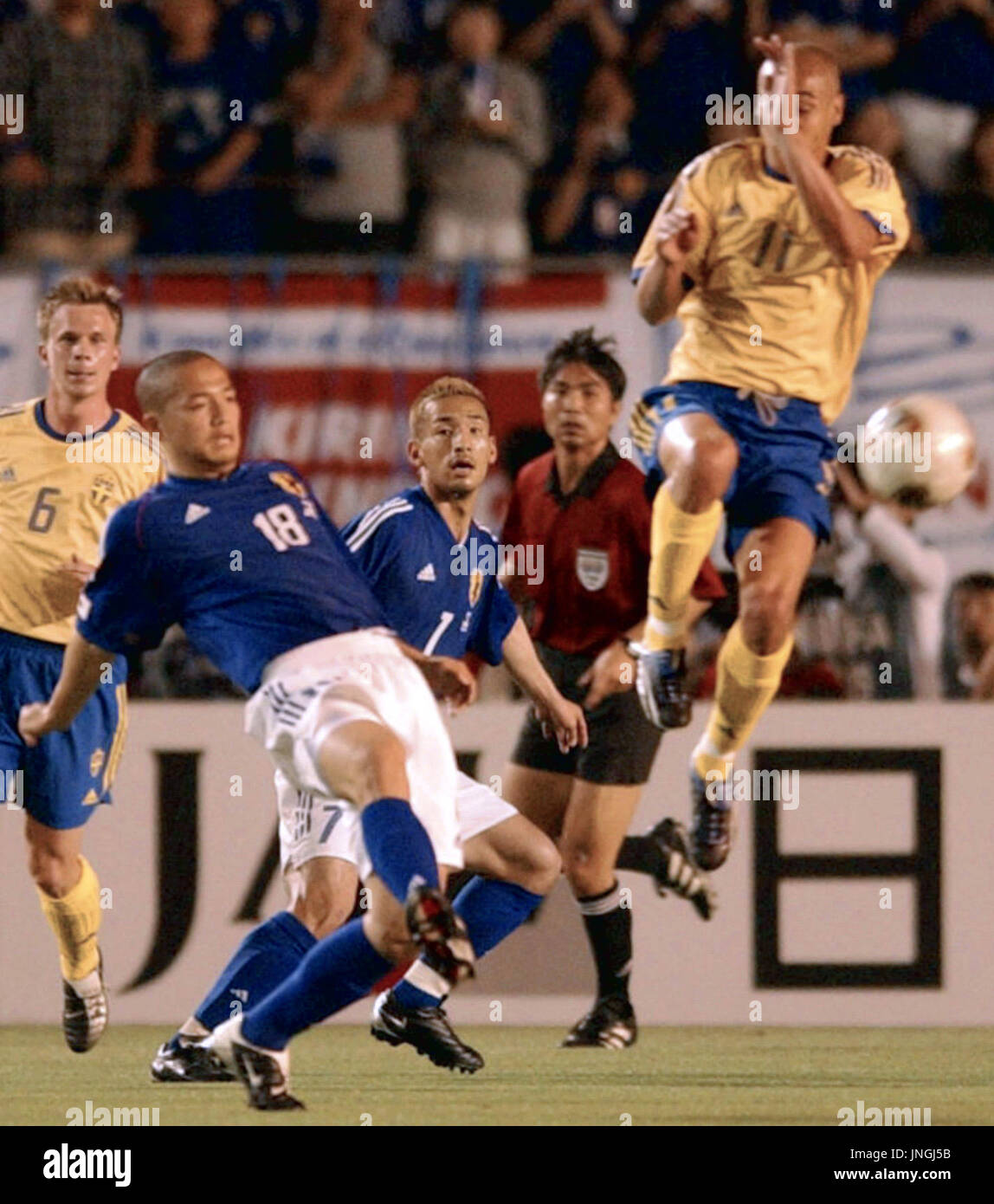 TOKYO, Japan - Japan midfielder Shinji Ono (2nd from L) challenges ...