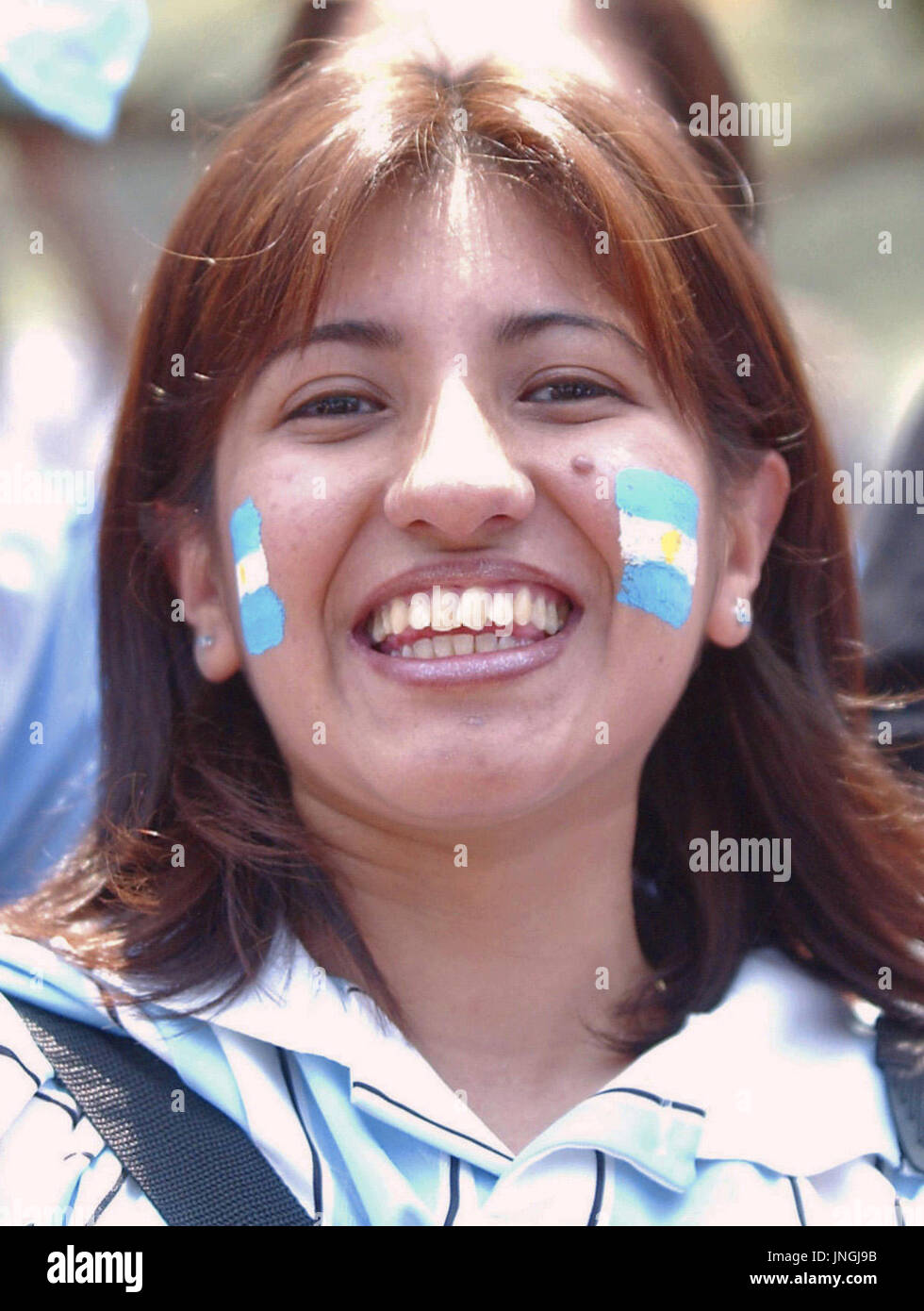 KASHIMA, Japan - An Argentina fan with her face painted with the ...