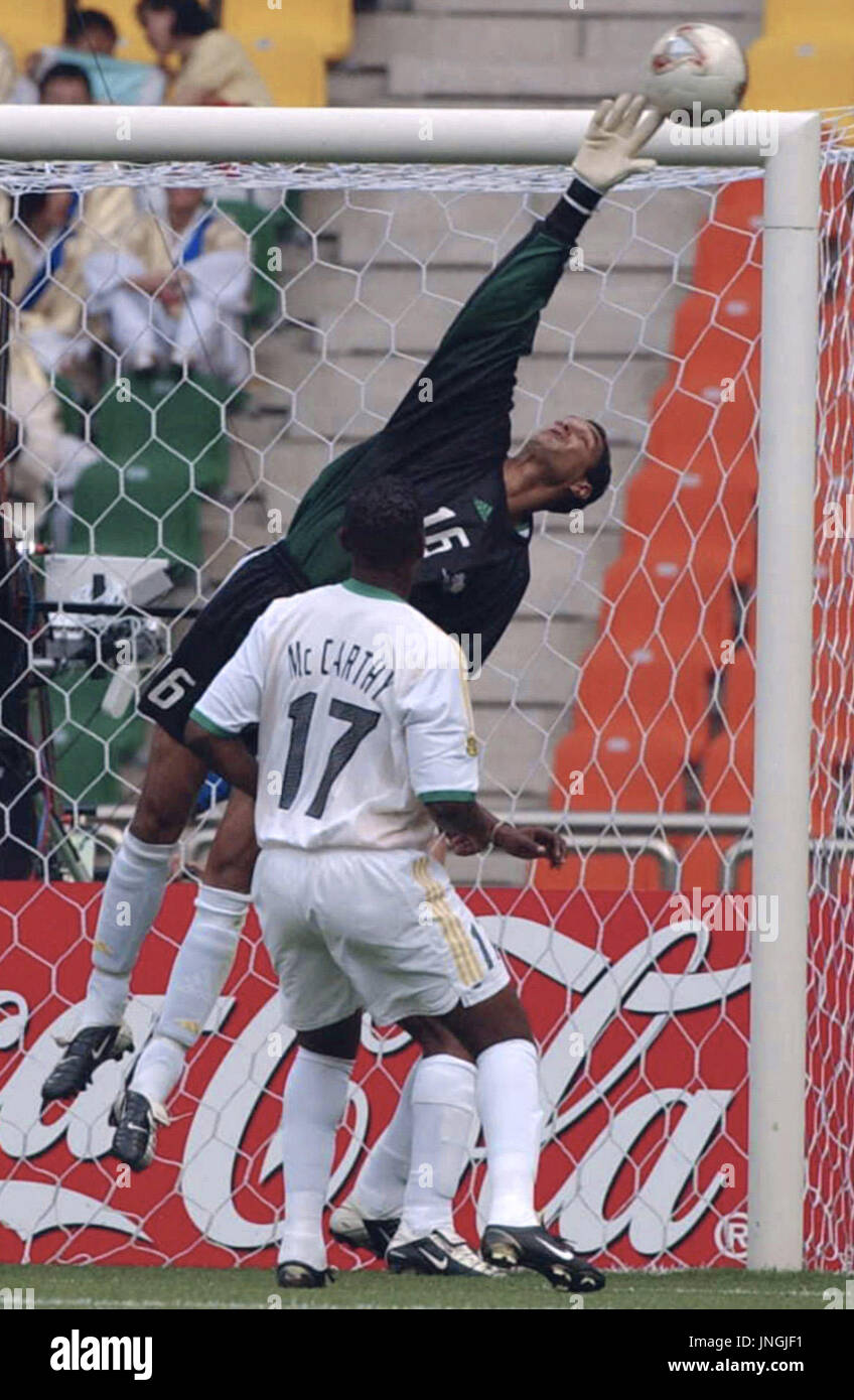 PUSAN, South Korea - South Africa goalkeeper Andre Arendse tips a shot ...