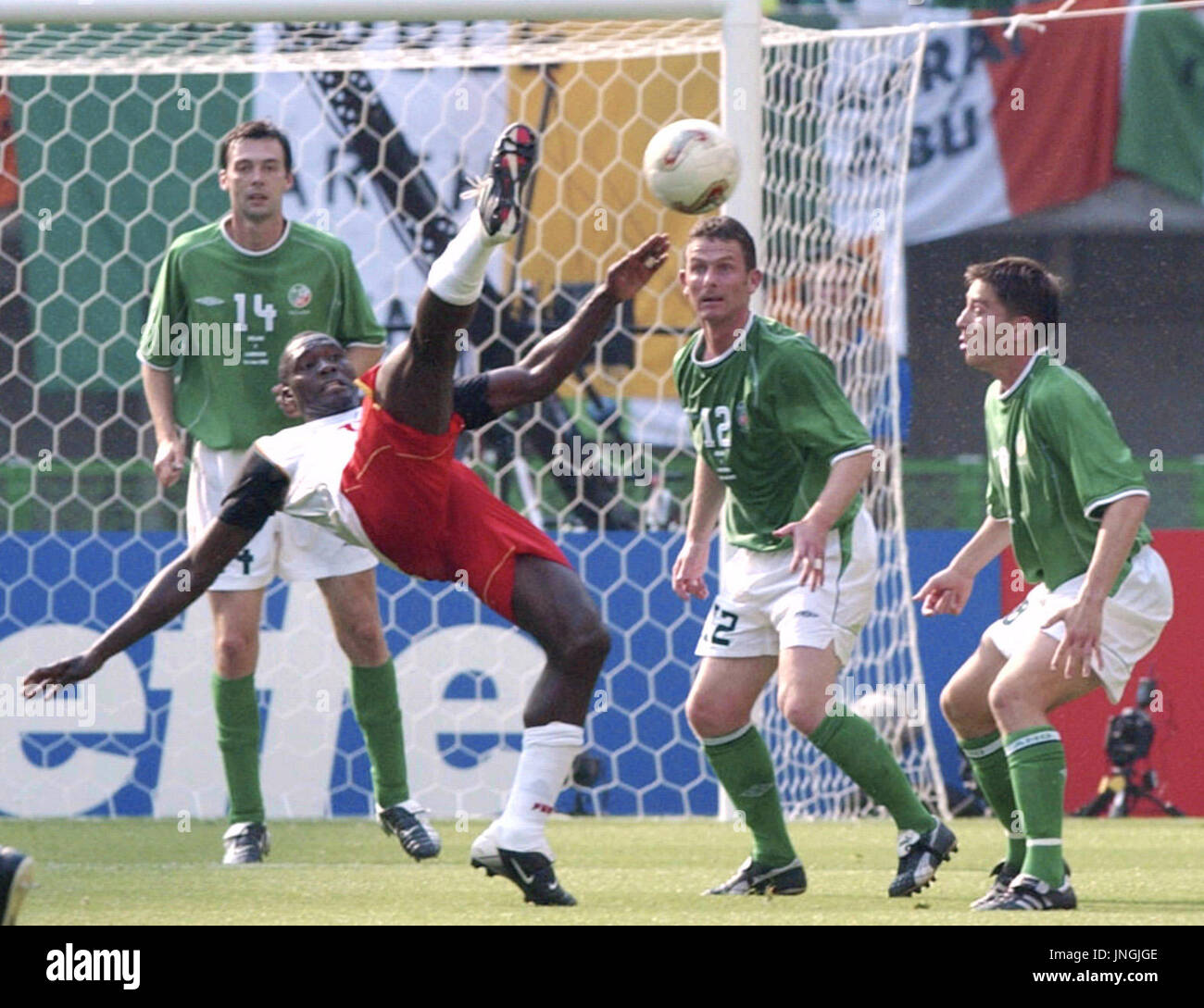 NIIGATA, Japan - Cameroon striker Patrick Mboma attempts an overhead ...