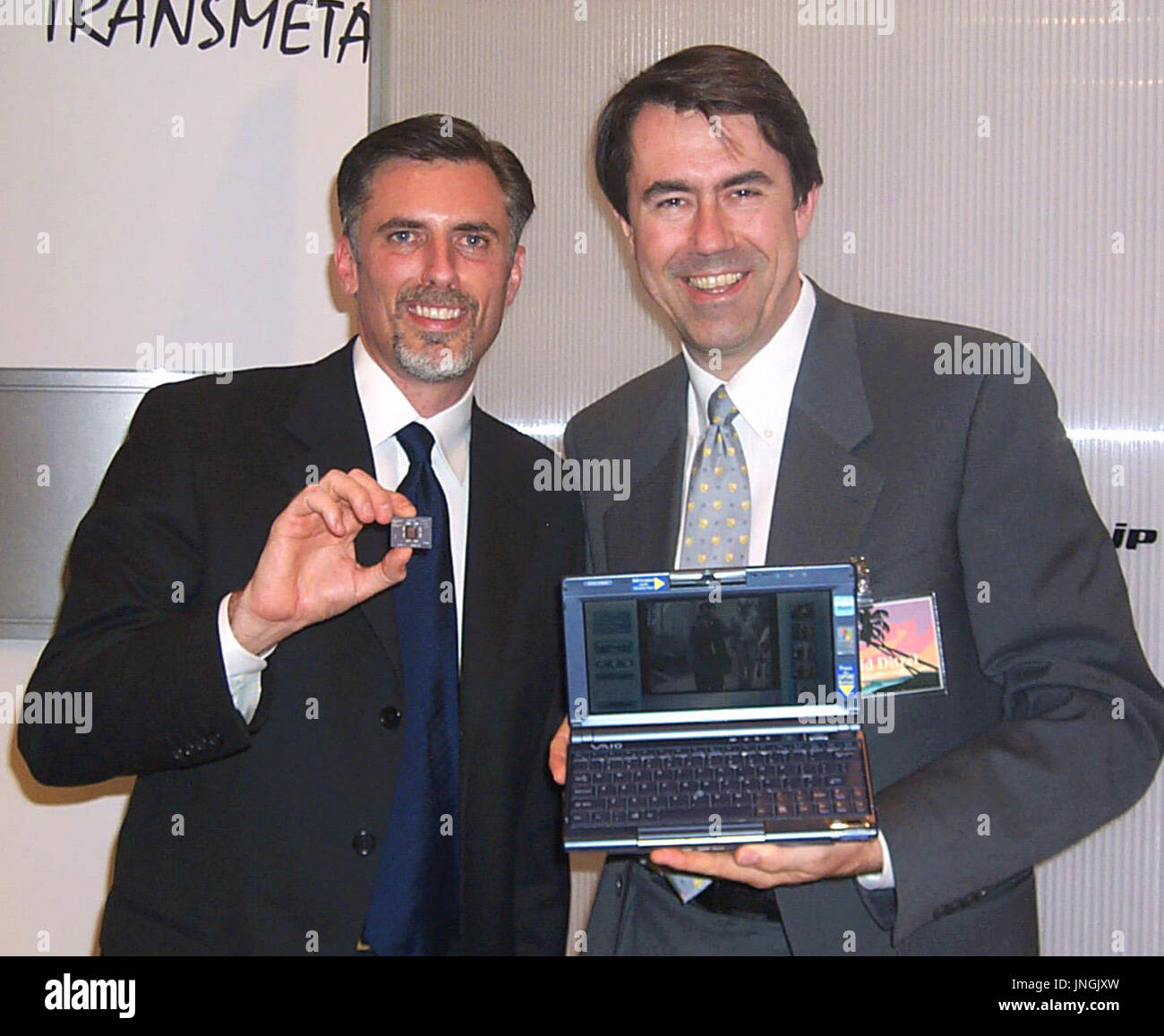 TOKYO, Japan - Transmeta Corp. President Matthew Perry (L) holds his ...