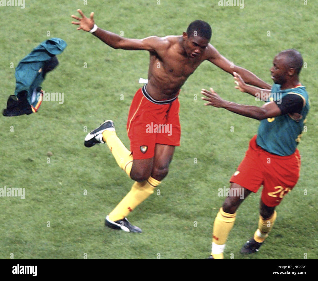 SAITAMA, Japan - Cameroon forward Samuel Eto'o (9) takes off his shirt ...