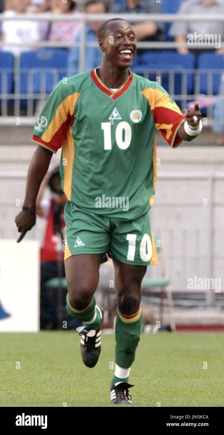 SUWON, South Korea - Midfielder Khalilou Fadiga celebrates after giving ...