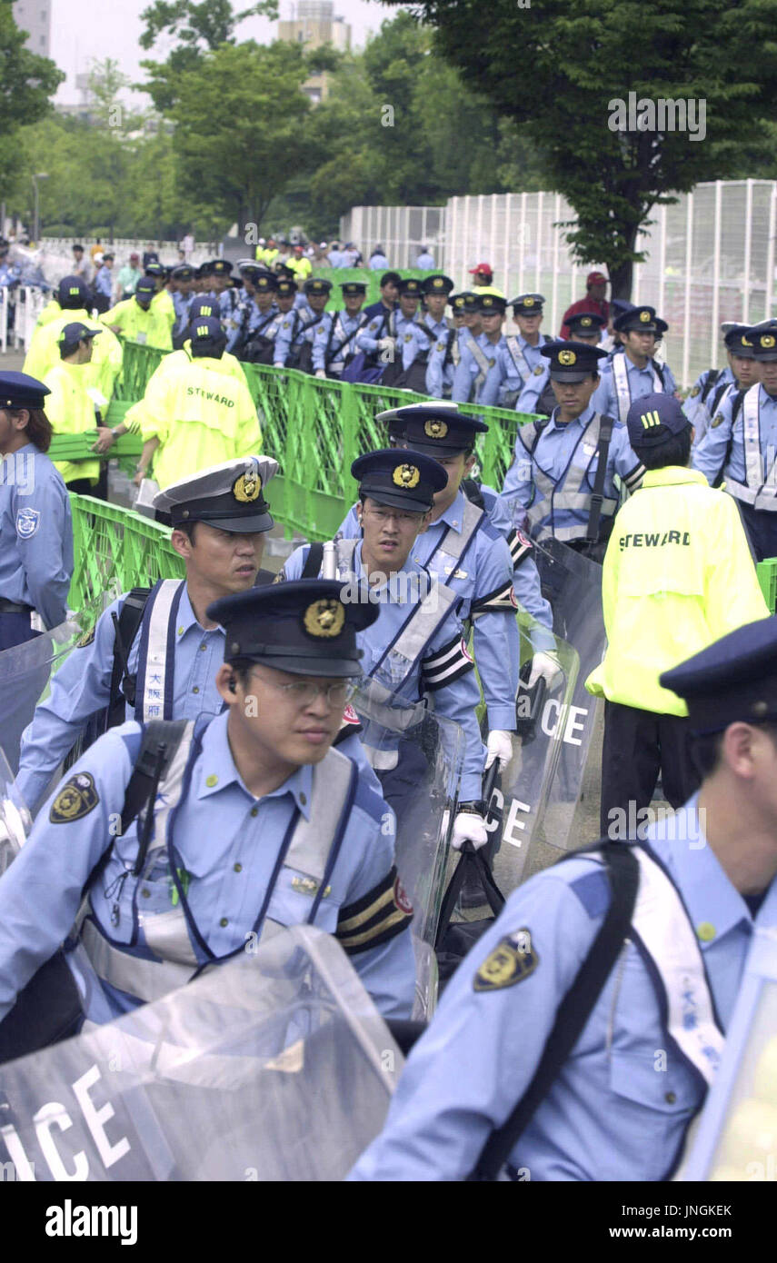 OSAKA, Japan - Policemen prepare to take positions at Nagai Stadium in ...