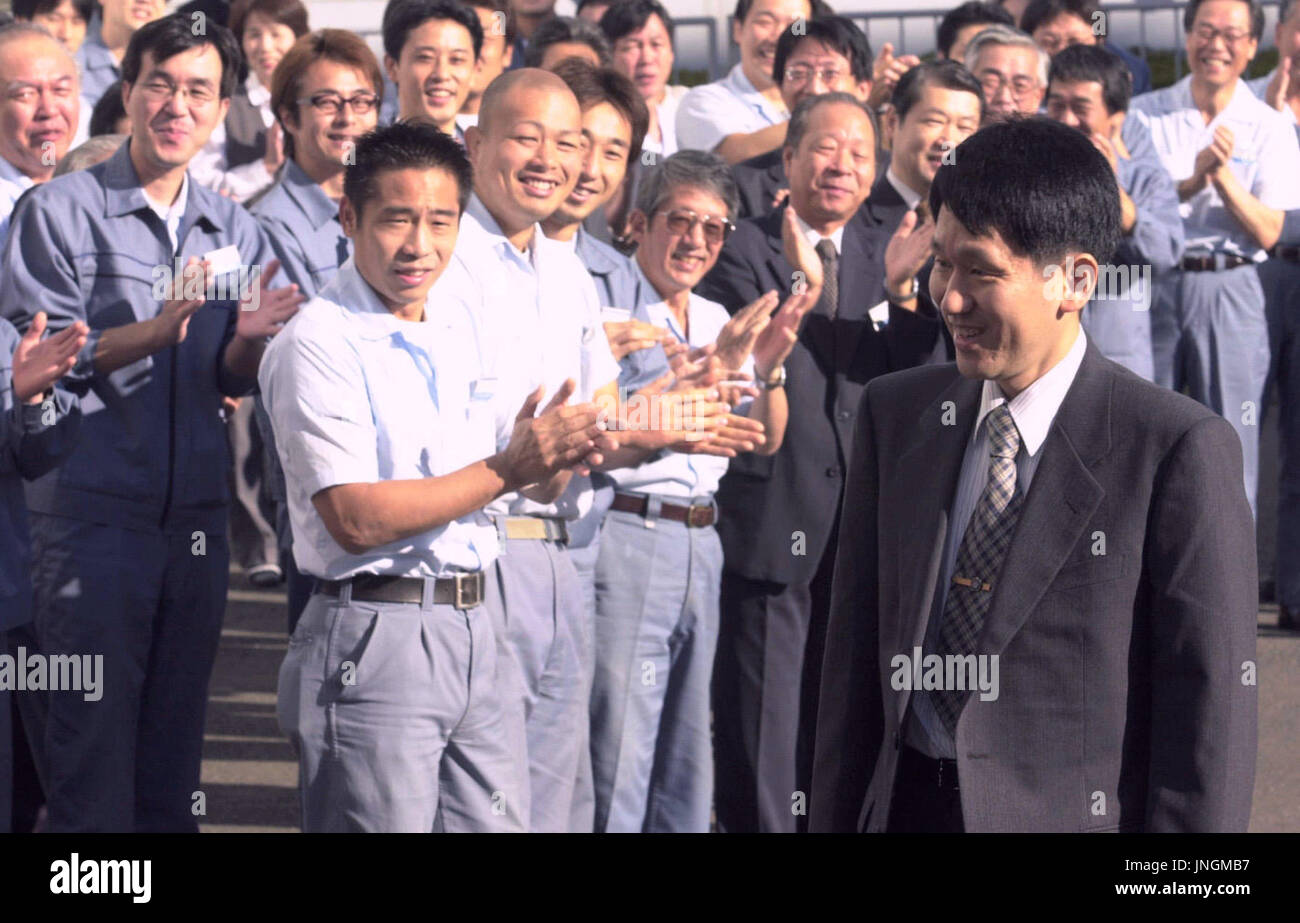 KYOTO, Japan - Japanese engineer Koichi Tanaka (R) is congratulated by ...