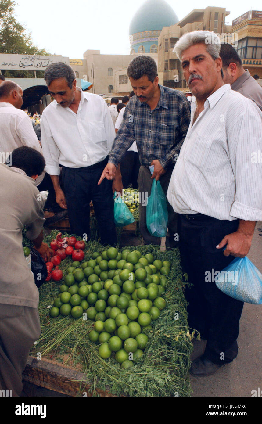BAGHDAD, Iraq - Men shop at an open-door market in Baghdad on Oct. 17 ...