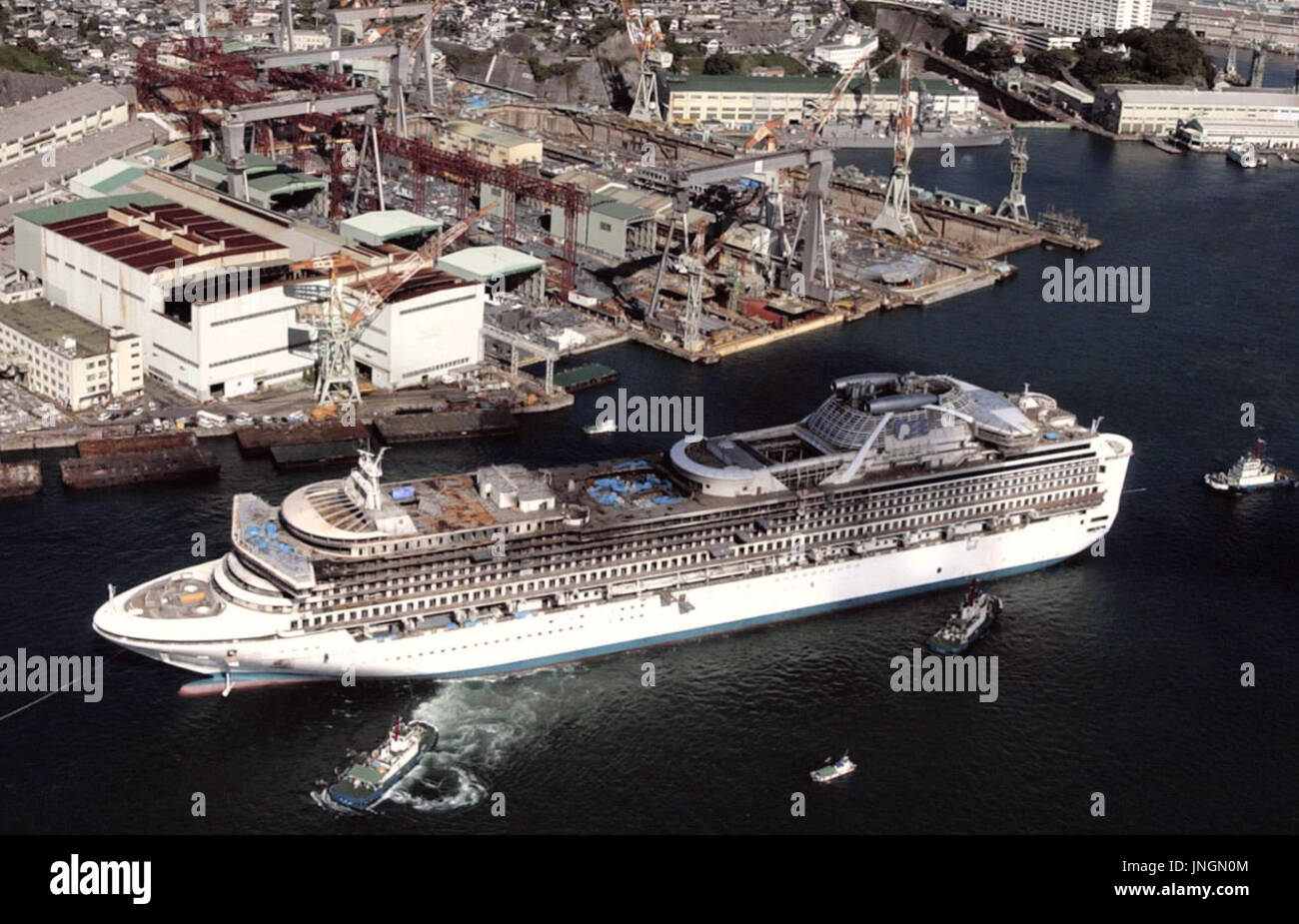 NAGASAKI, Japan - The 113,000-ton cruise ship Diamond Princess is towed ...