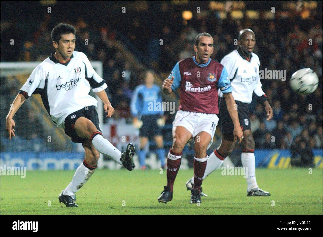 LONDON, England - Fulham midfielder Junichi Inamoto tries to pass the ...