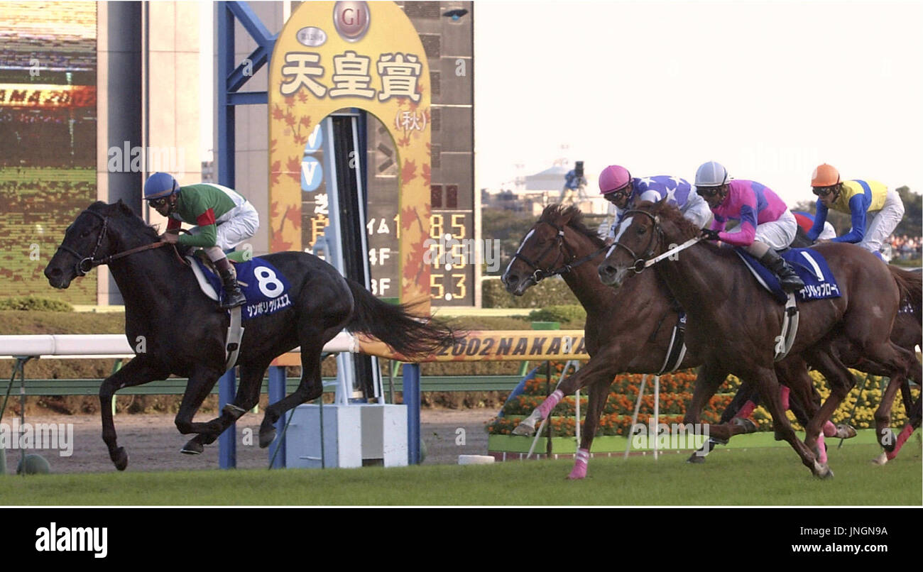 FUNABASHI, Japan - Symboli Kris S (L) crosses the finishing line to win ...