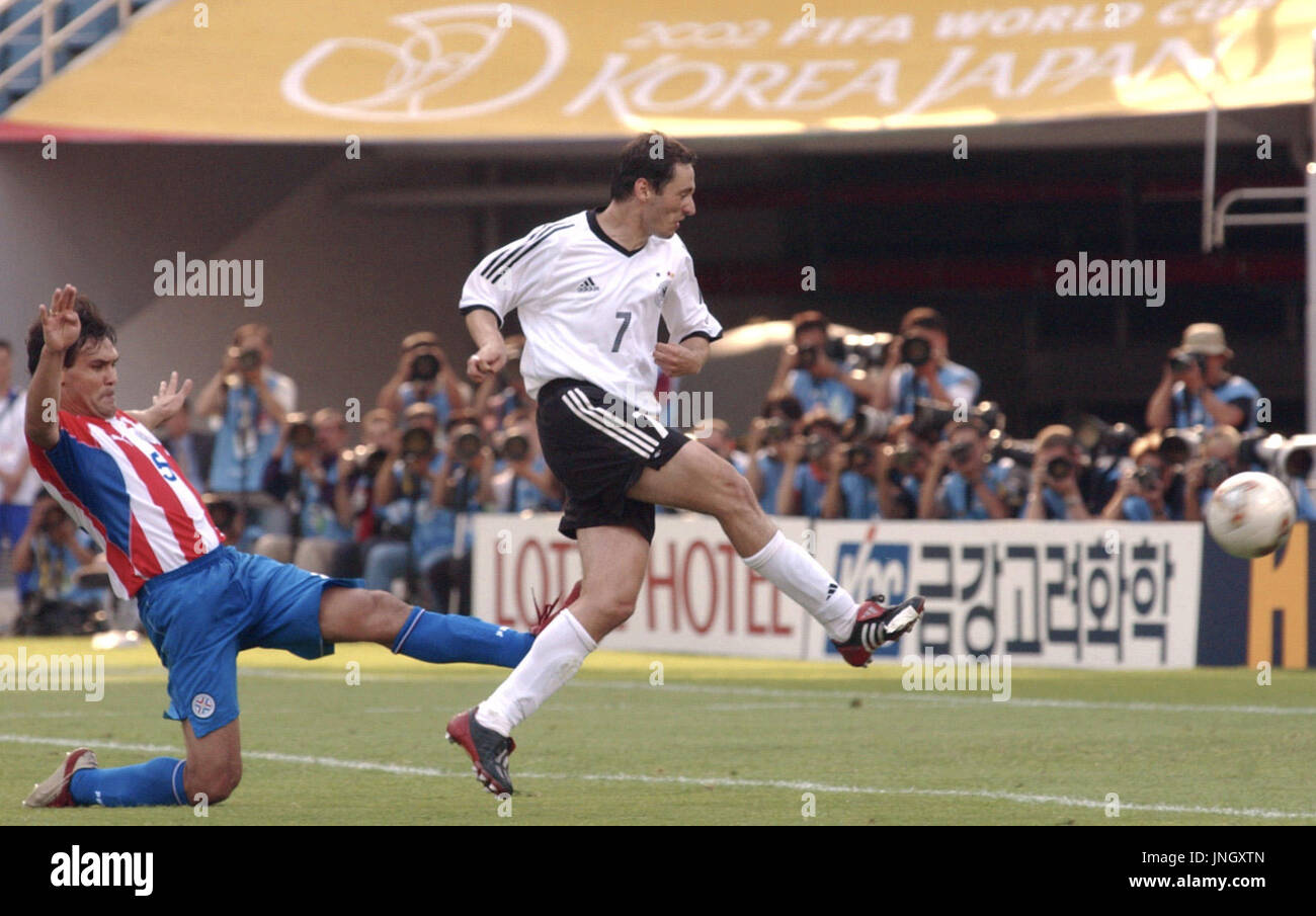 SOGWIPO, South Korea - Germany striker Oliver Neuville scores the game ...