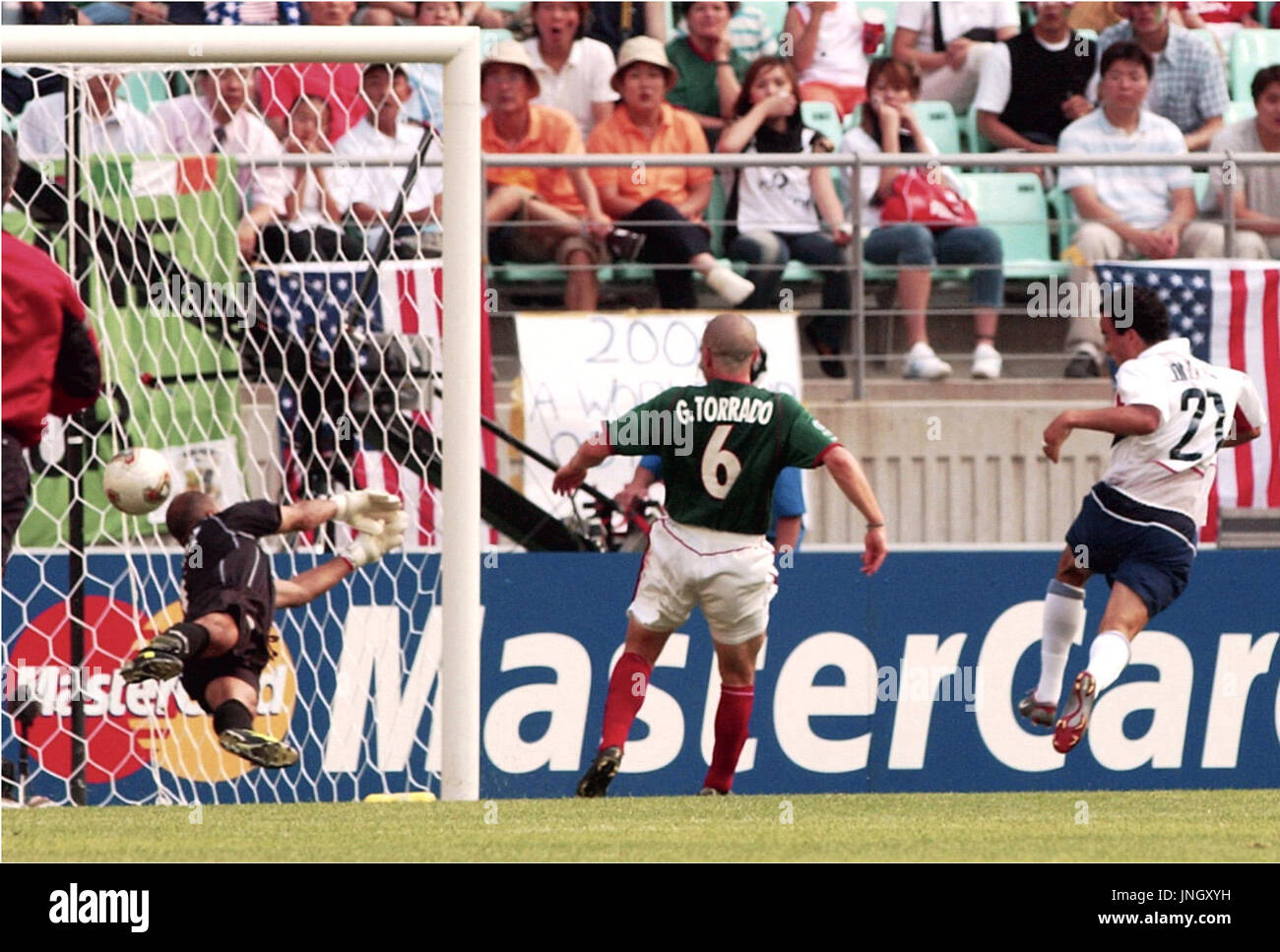 CHONJU, South Korea - Landon Donovan of the United States (R) heads in ...