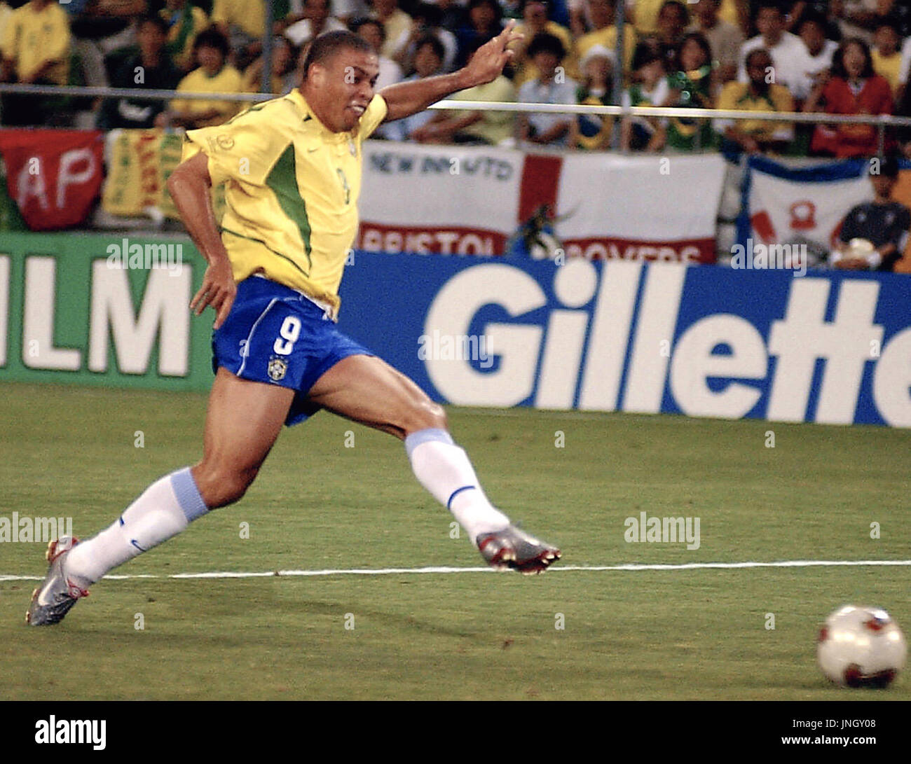 KOBE, Japan - Ronaldo drives in the second goal for Brazil in the 87th ...