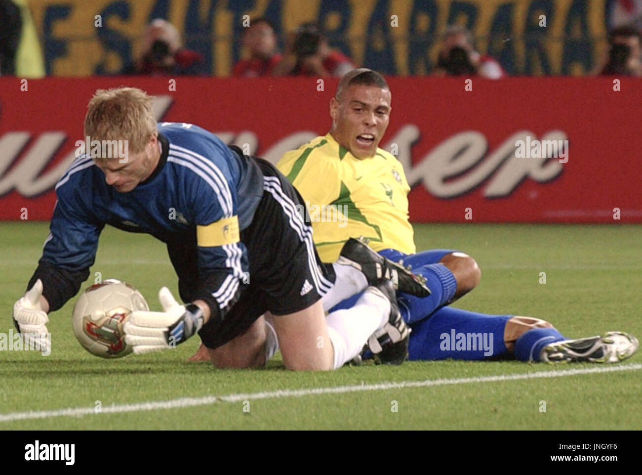 YOKOHAMA, Japan - Germany goalkeeper Oliver Kahn (L) saves from Brazil ...