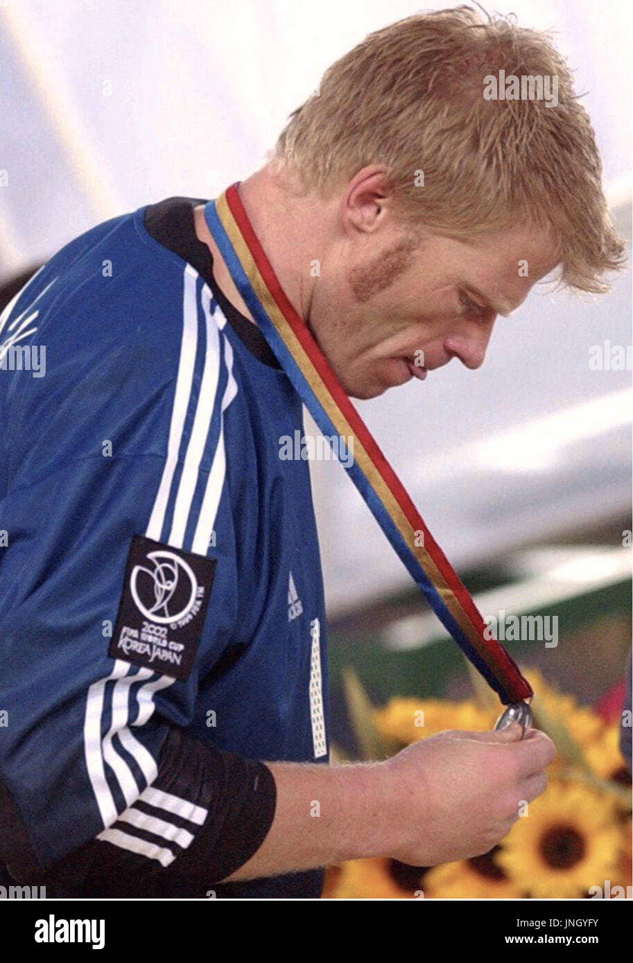 YOKOHAMA, Japan - German goalkeeper Oliver Kahn looks at his World Cup ...