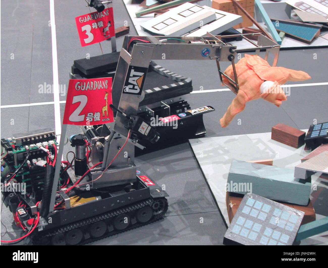 TOYONAKA, Japan - Photo shows a robot rescuing a doll from debris ...