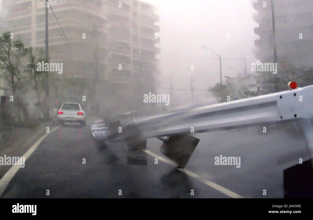 NAHA, Japan - A crash barrier in Naha, Okinawa Prefecture, collapses ...