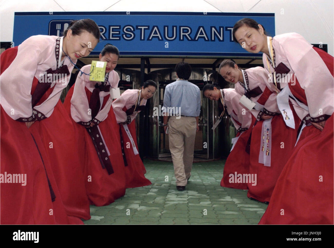PUSAN, South Korea - Women wearing ethnic Korean clothing welcome ...