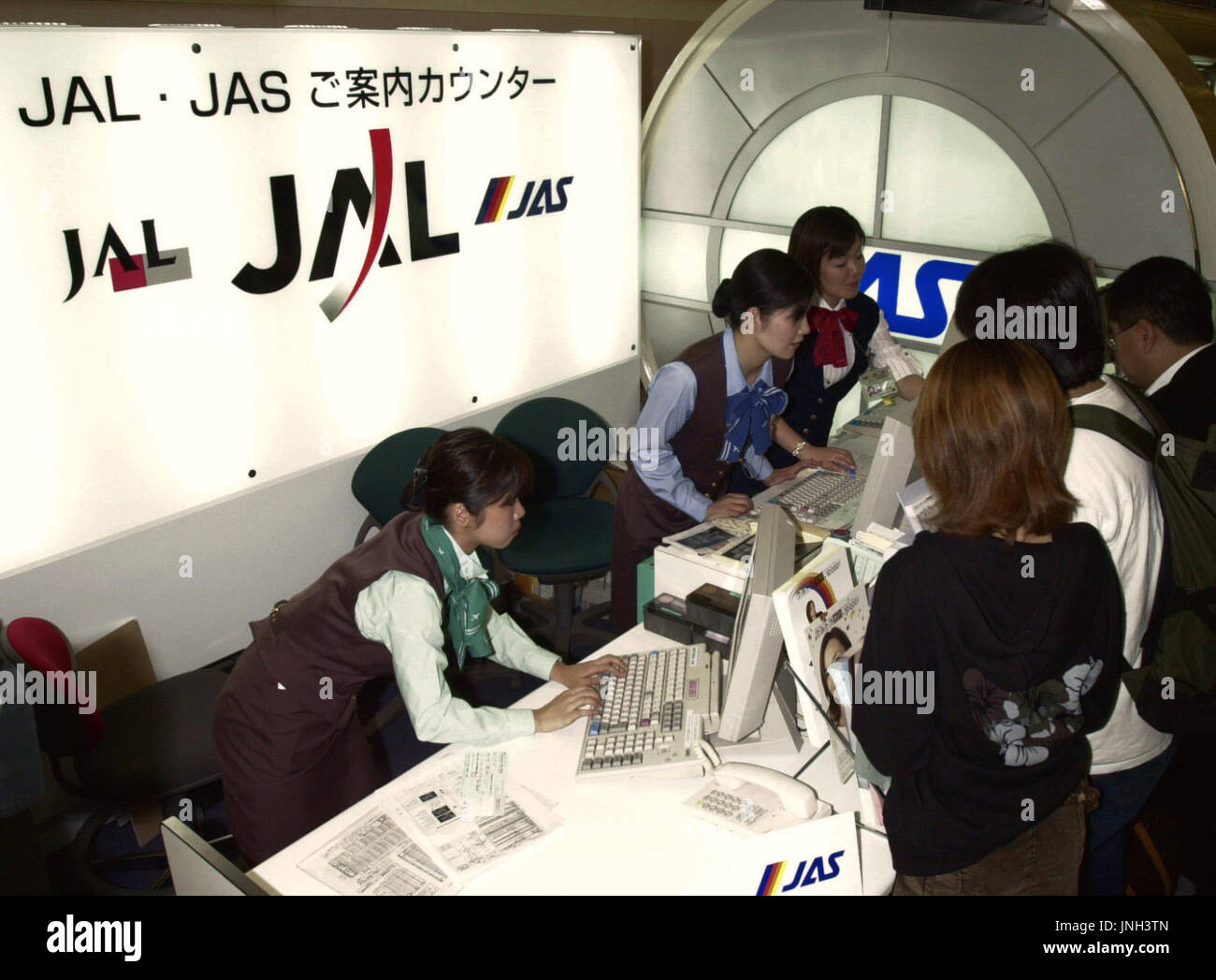 TOKYO, Japan - Women work at a newly-opened JAL group counter at Tokyo ...