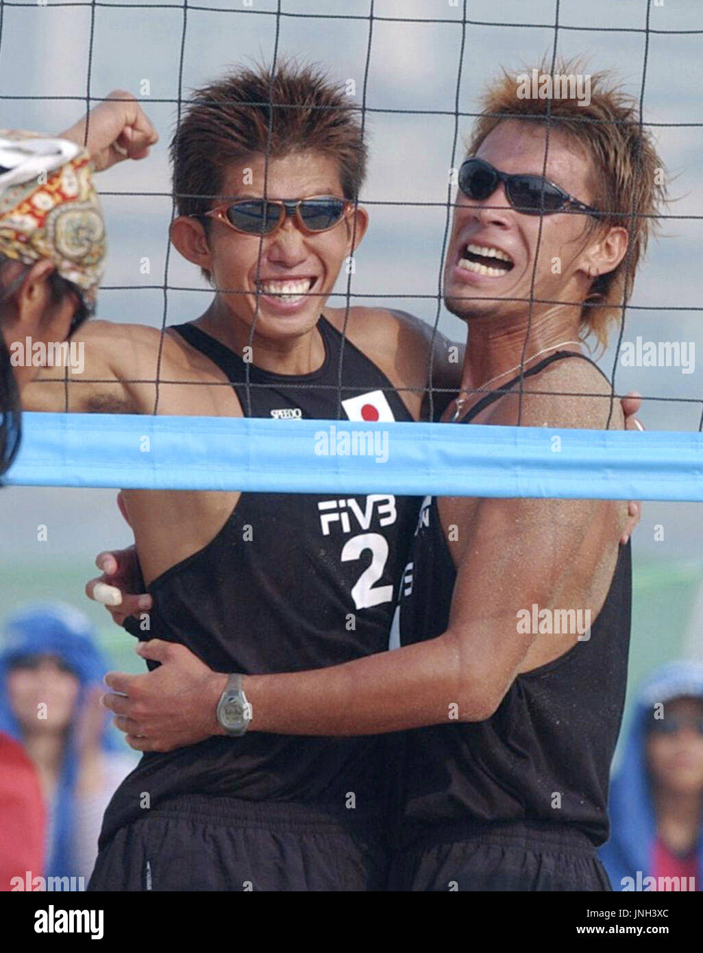 PUSAN, South Korea - Katsuhiro Shiratori (L) and Satoshi Watanabe celebrate after winning in ...