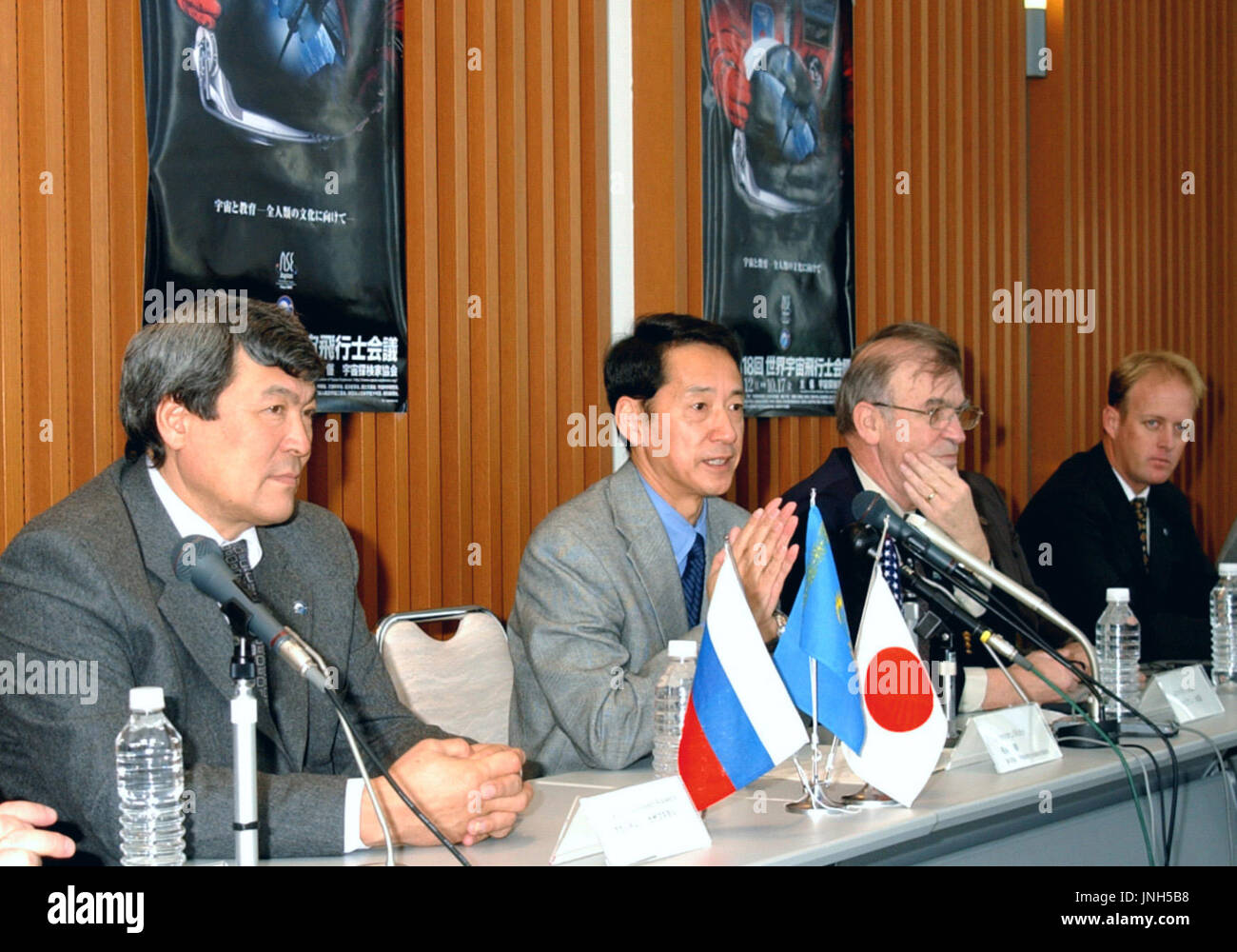 TOKYO, Japan - Japanese astronaut Mamoru Mohri (2nd from L), flanked by ...