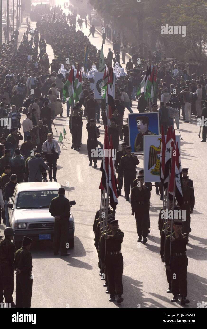 BAGHDAD, Iraq - Carrying portraits of President Saddam Hussein, Iraqi ...