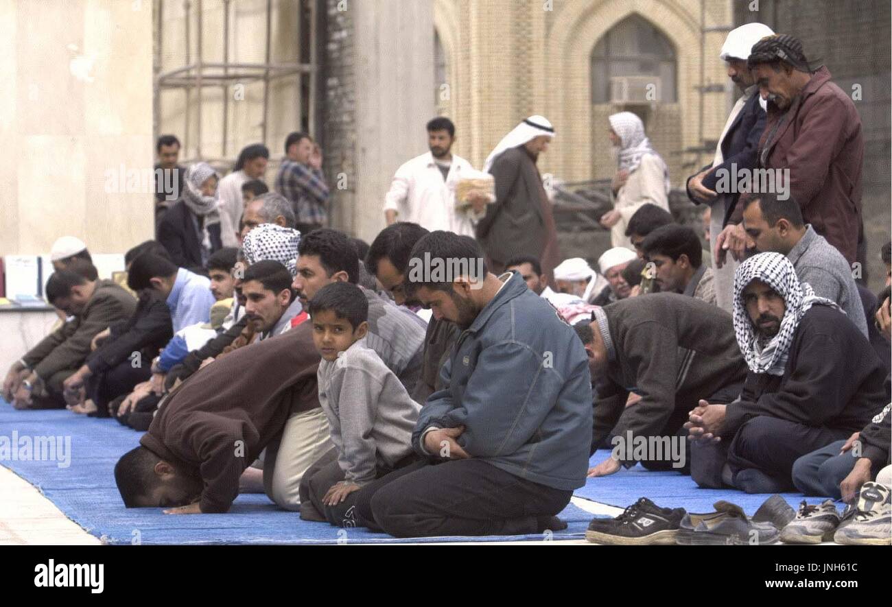 BAGHDAD, Iraq - Iraqi families pray in Baghdad. Photo taken in early ...