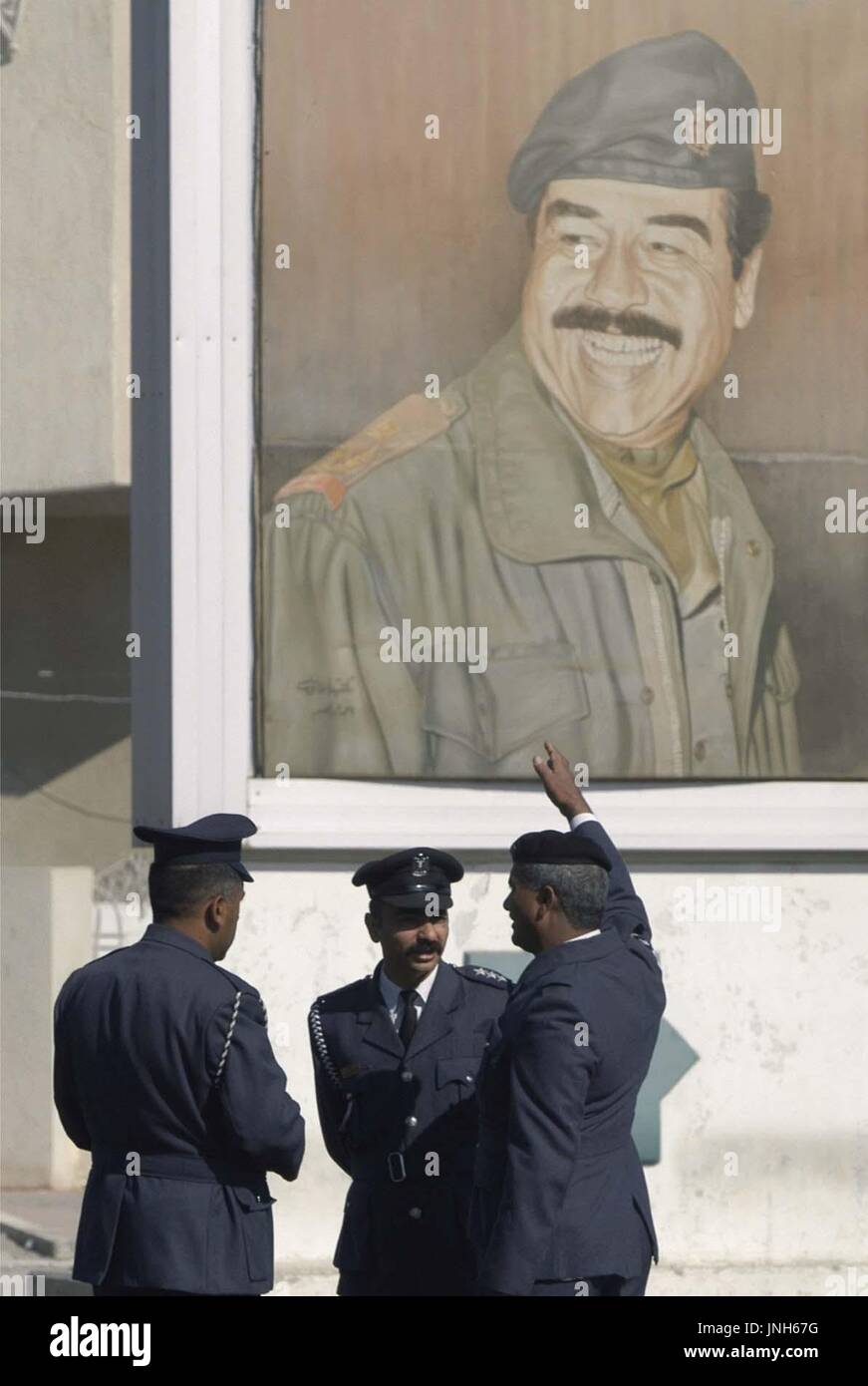 BAGHDAD, Iraq - Iraqi police seen on duty under a portrait of Iraqi ...