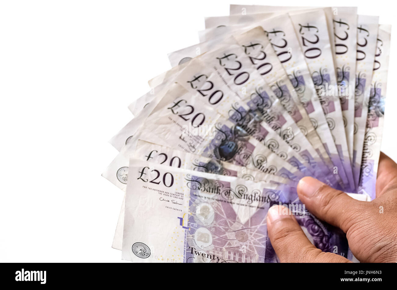 Counting Twenty pounds notes Stock Photo - Alamy