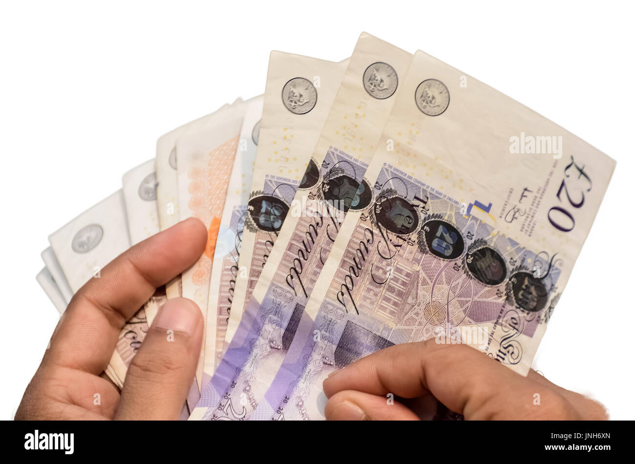 Counting Twenty pounds notes Stock Photo - Alamy