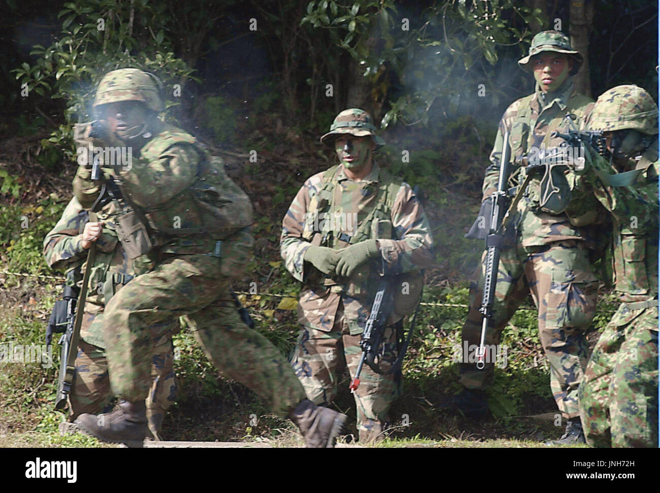 OITA, Japan - A Japanese Ground Self-Defense Force member (foreground ...