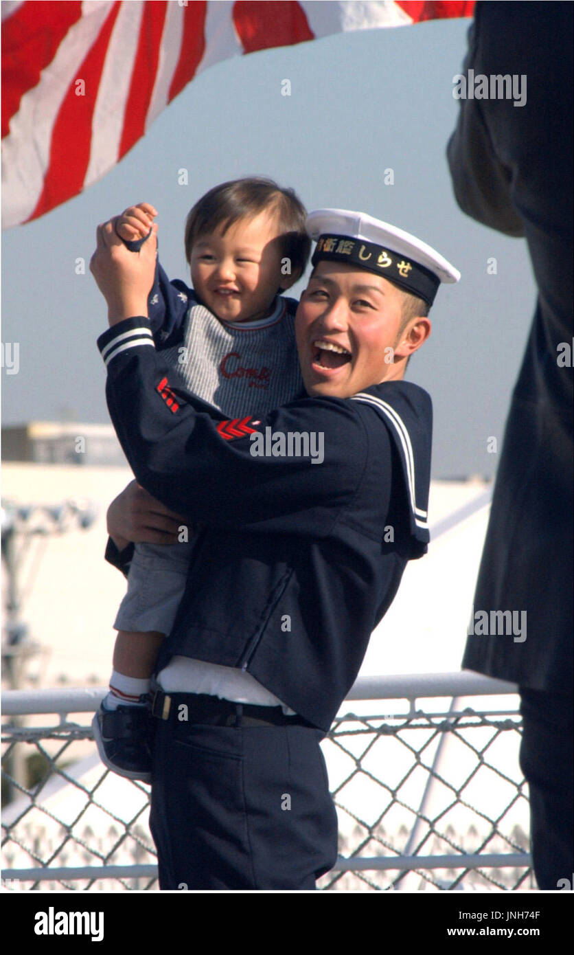 TOKYO, Japan - A crew member of the Japanese icebreaker Shirase holds ...